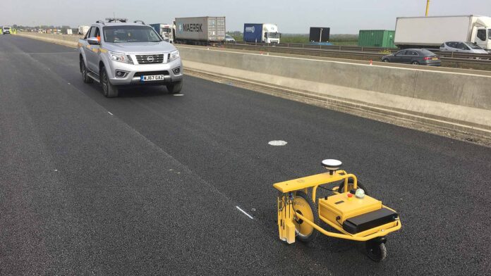 Highways England is using an autonomous ROBOT to paint white lines